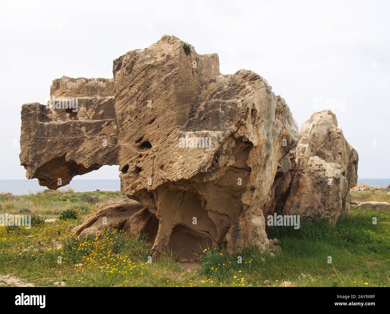 exposed carved stone tomb with steps in the tomb of the kings area in ...