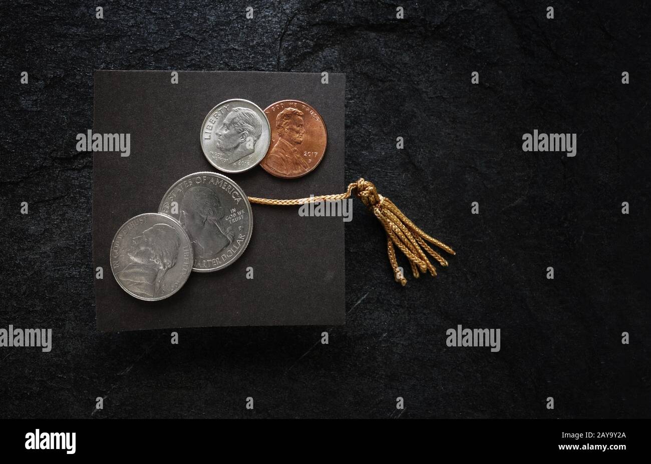 Graduation cap with money -- education cost Stock Photo - Alamy