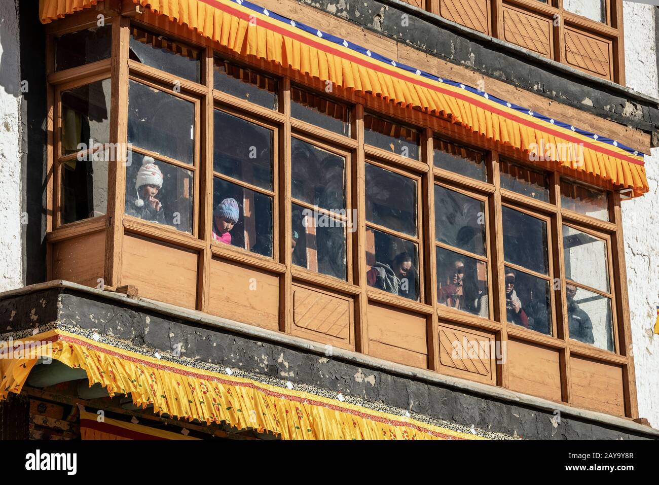 Spituk Gompa window with Gustor festival watchers, Leh, Ladakh Stock ...