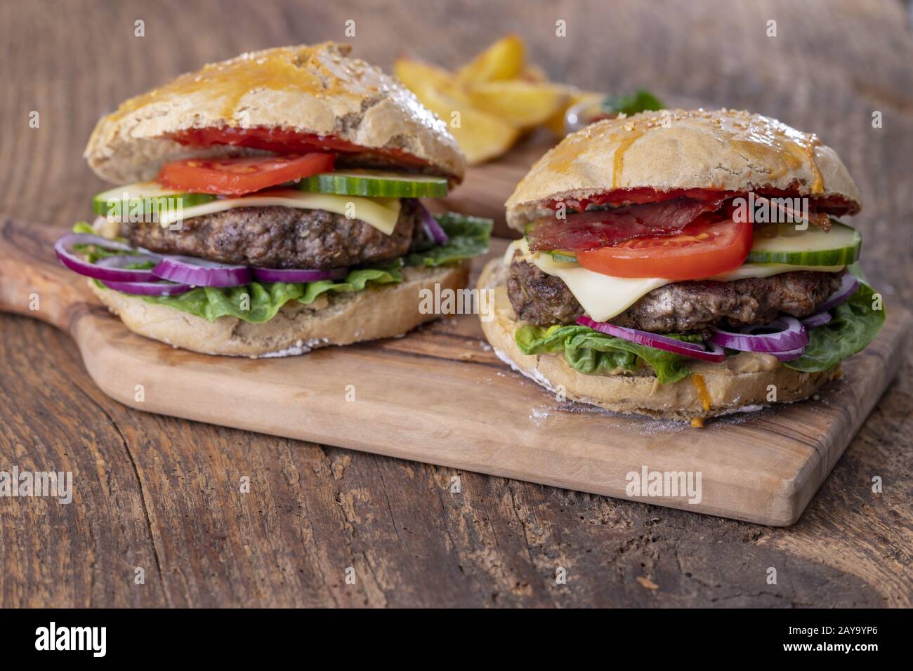 homemade burger on dark wood Stock Photo - Alamy