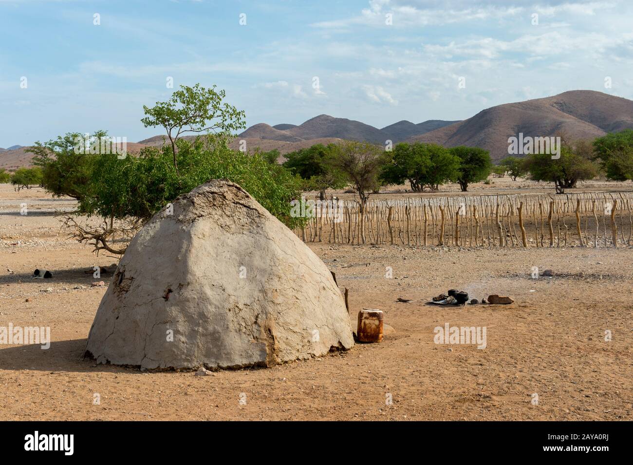 View of a cone shaped Himba house, made of mud, cow dung and mopane ...