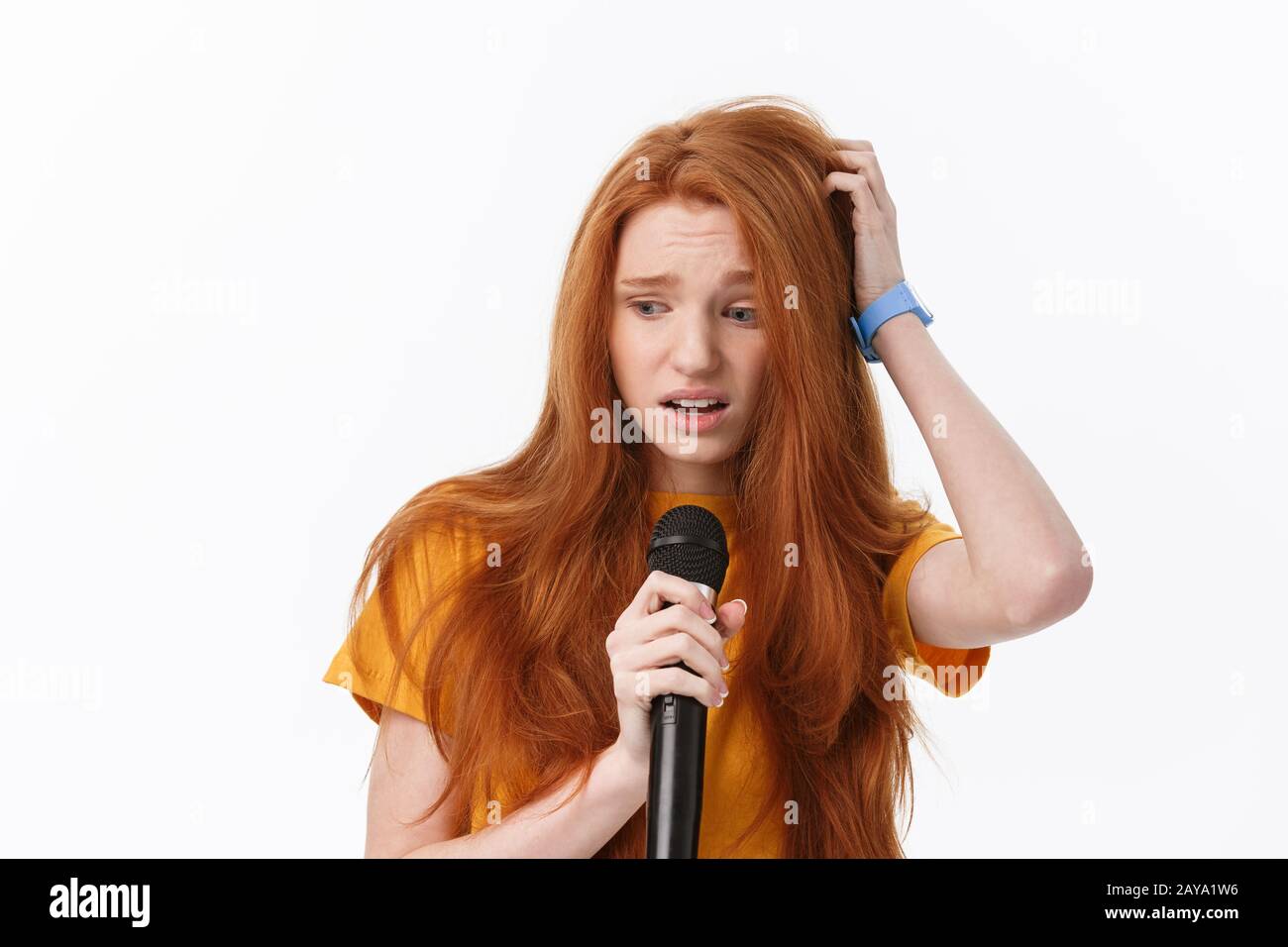 pretty woman singing with confuse and worry facial expression Stock ...