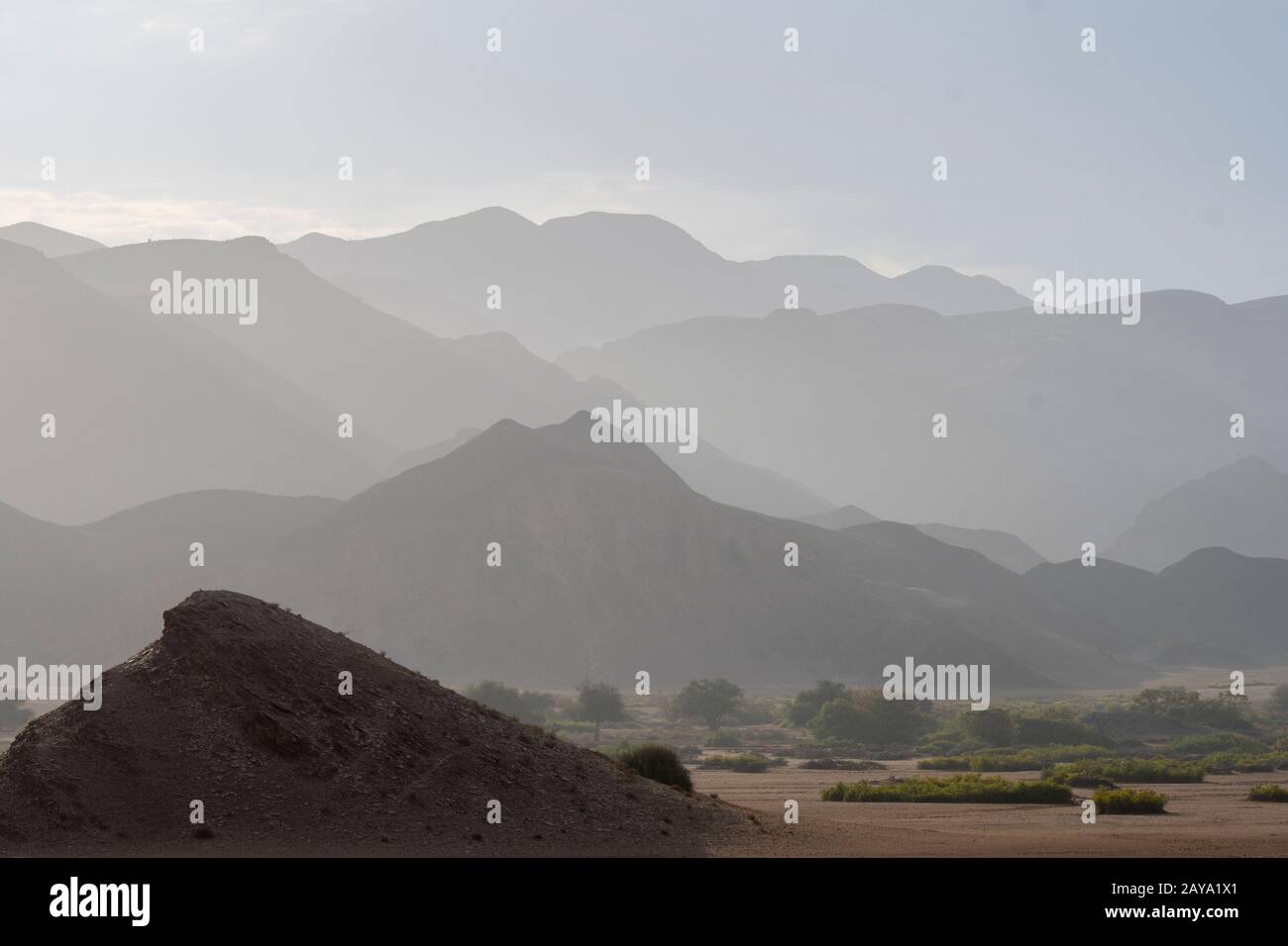 Morning haze after a short rain in the dry Huanib River Valley in ...