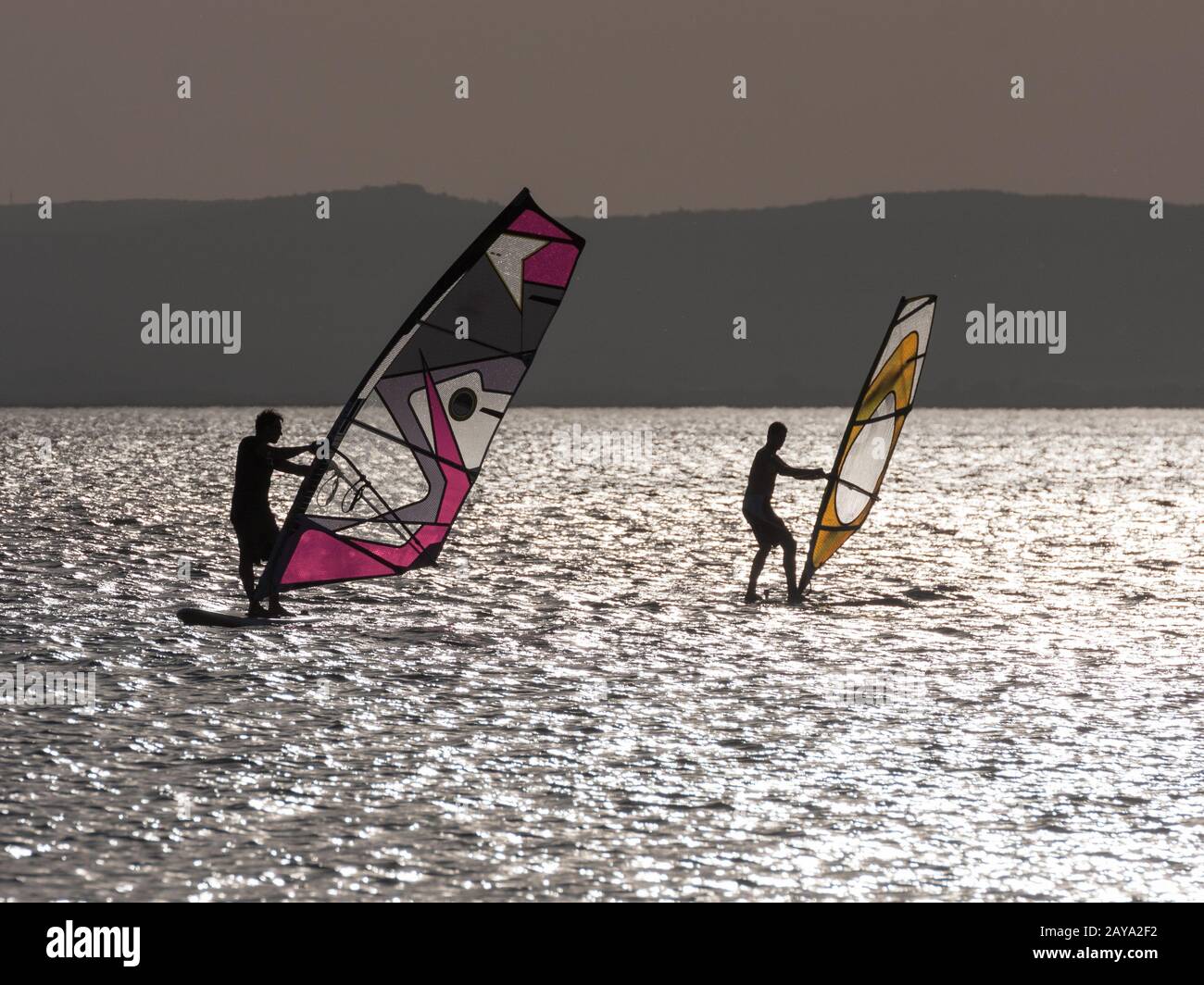 Two people surfing on their boards Stock Photo - Alamy
