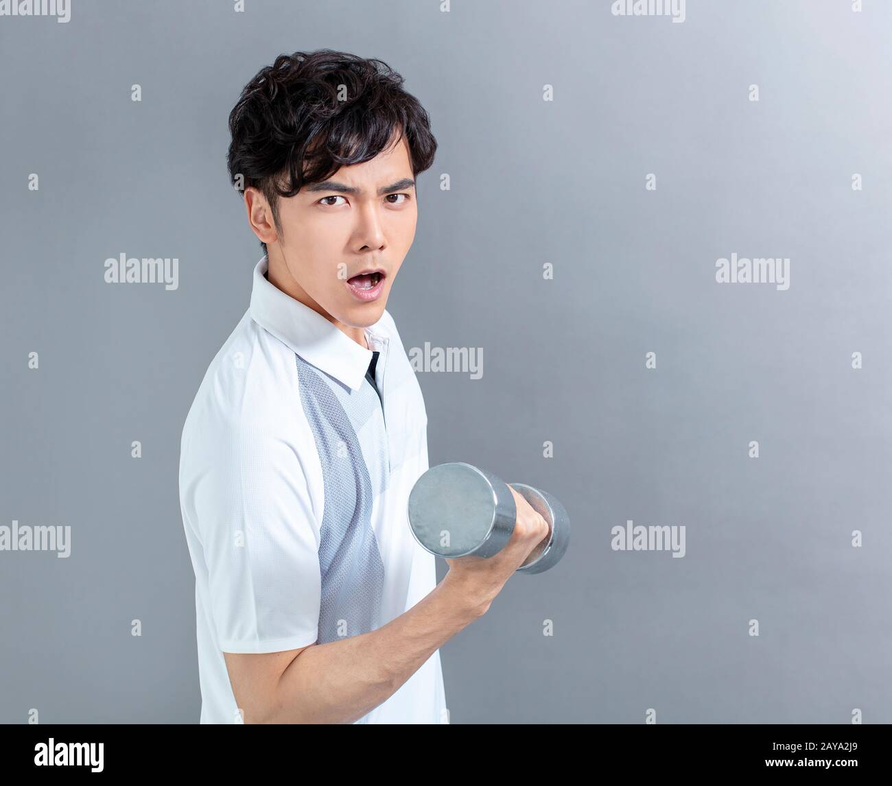 Man holding dumbbell hi-res stock photography and images - Alamy