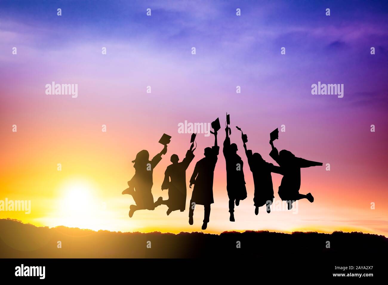 The Silhouette of graduation group celebrating and jumping on mountain ...