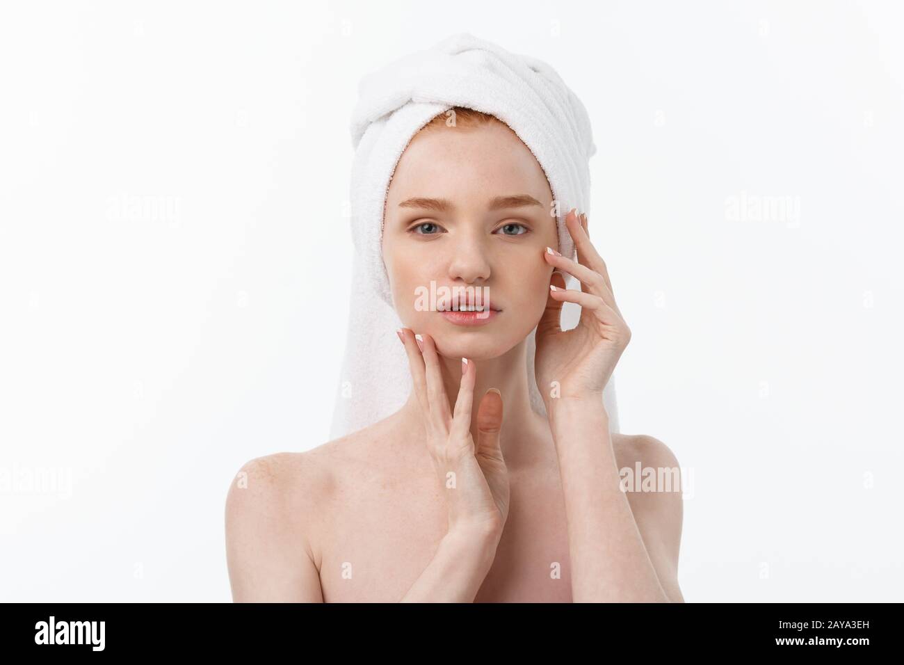 beautiful model applying cosmetic cream treatment on her face on white Stock Photo - Alamy
