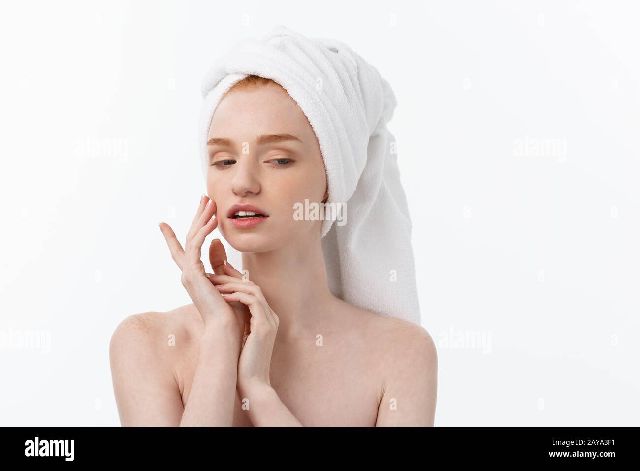beautiful model applying cosmetic cream treatment on her face on white Stock Photo - Alamy