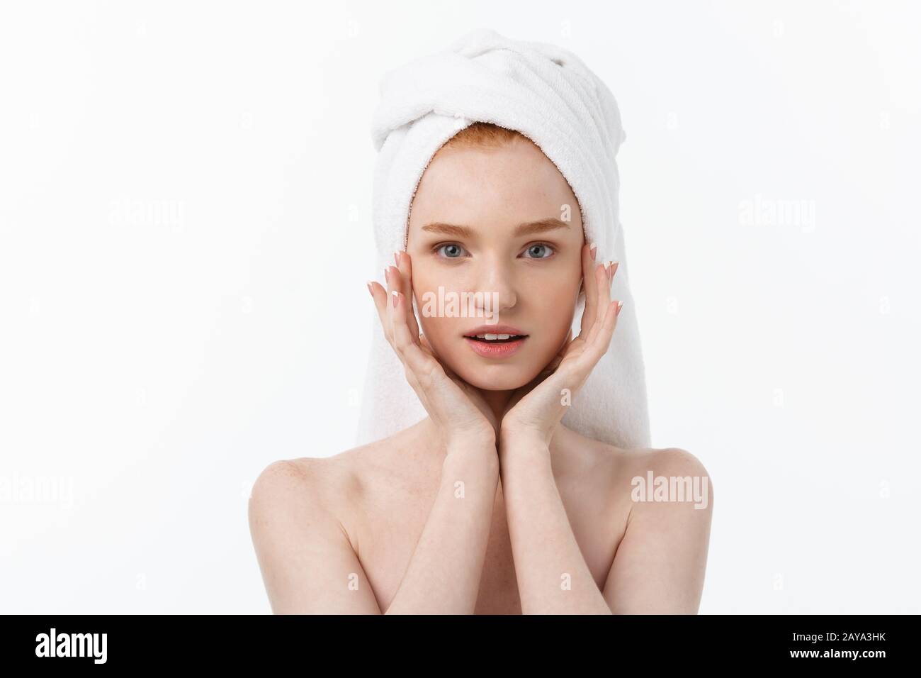 beautiful model applying cosmetic cream treatment on her face on white ...