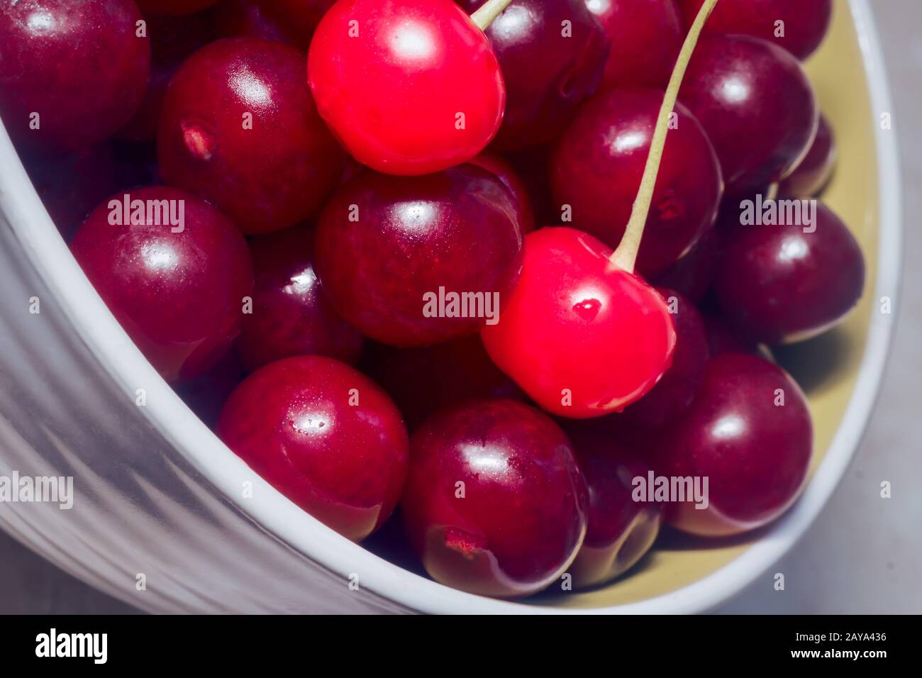 Big ripe cherry in a ceramic vase Stock Photo - Alamy