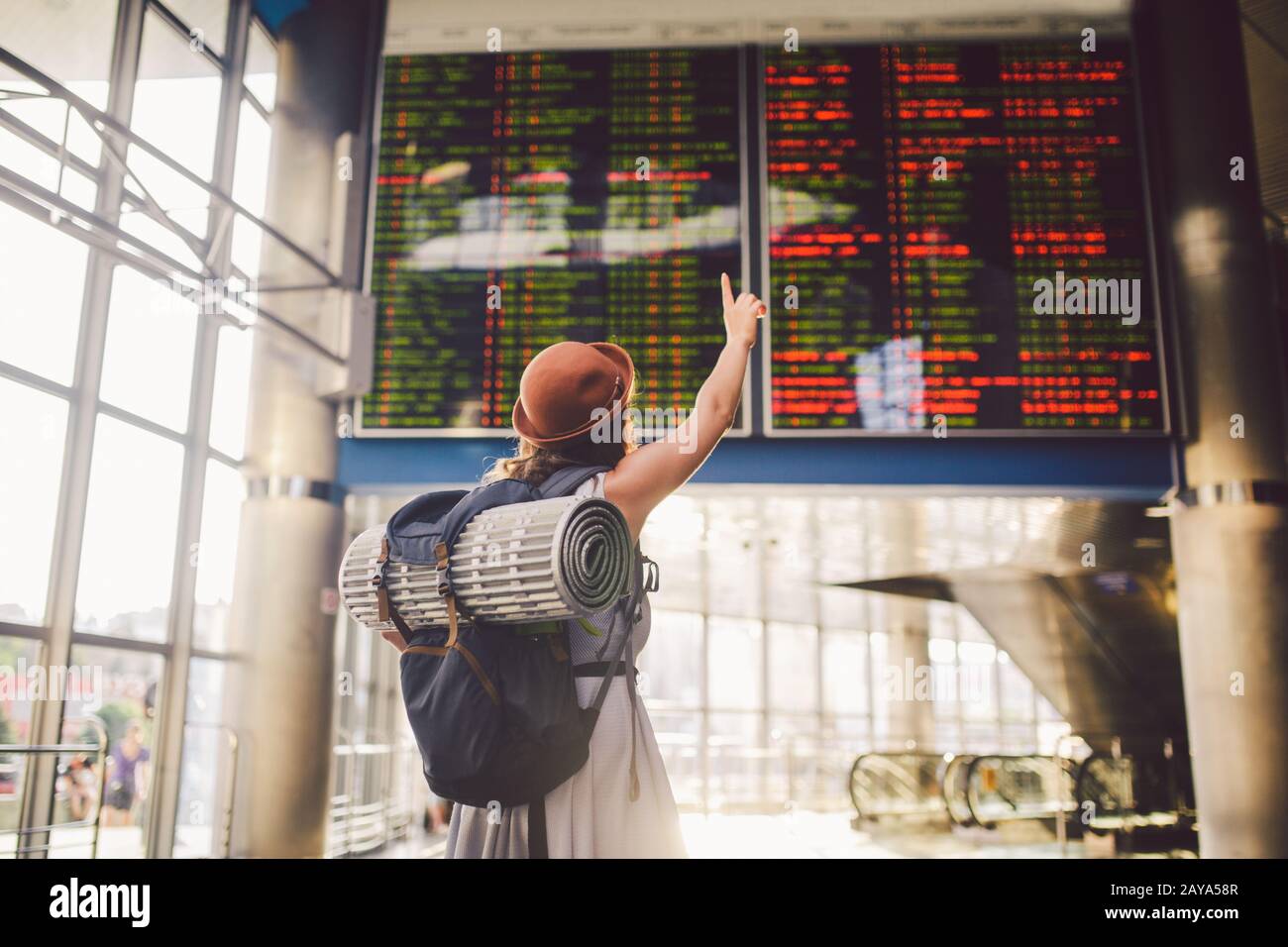 Theme travel public transport. young woman standing back in dress and ...