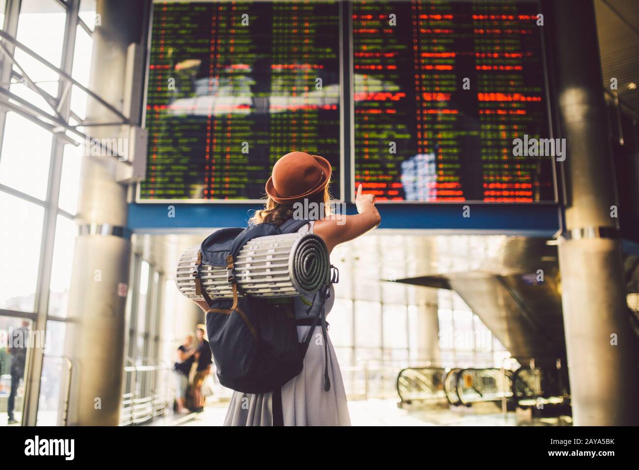 Theme travel public transport. young woman standing back in dress and ...