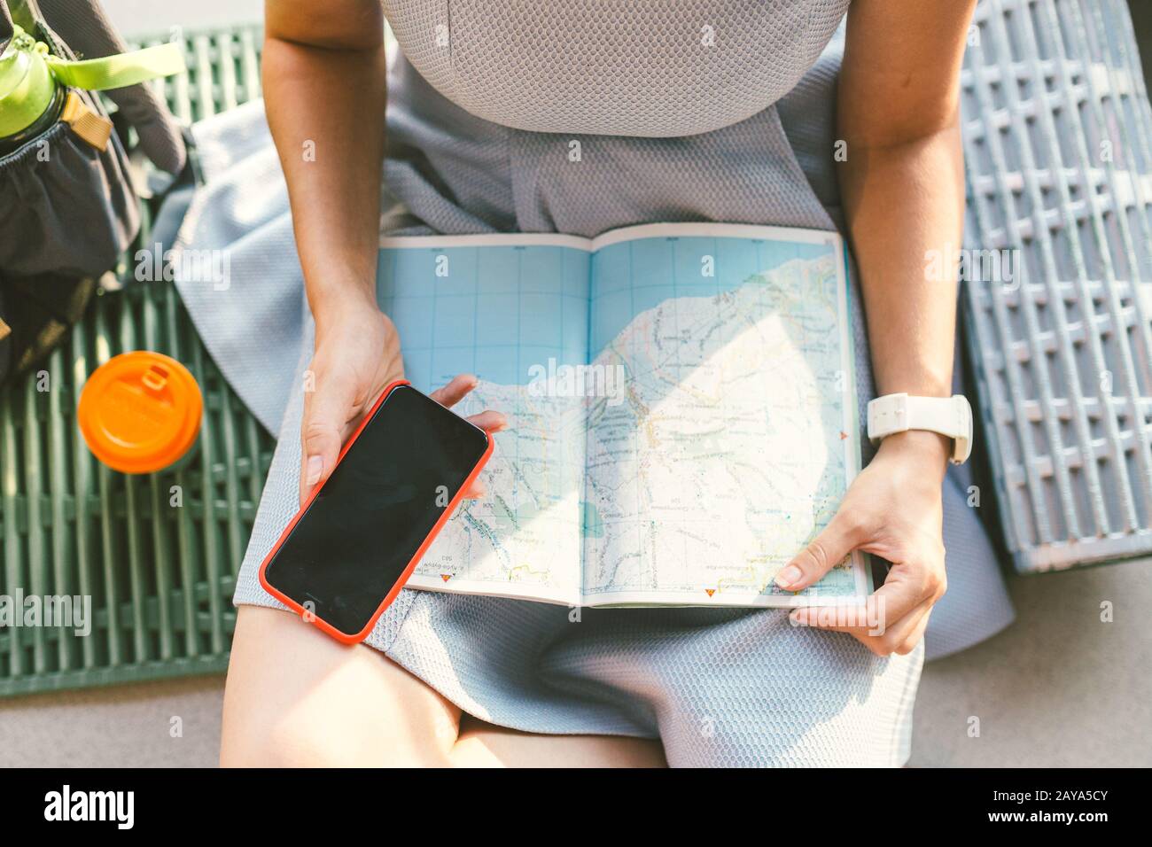 Theme travel planning. The top view hands Caucasian woman uses smart ...