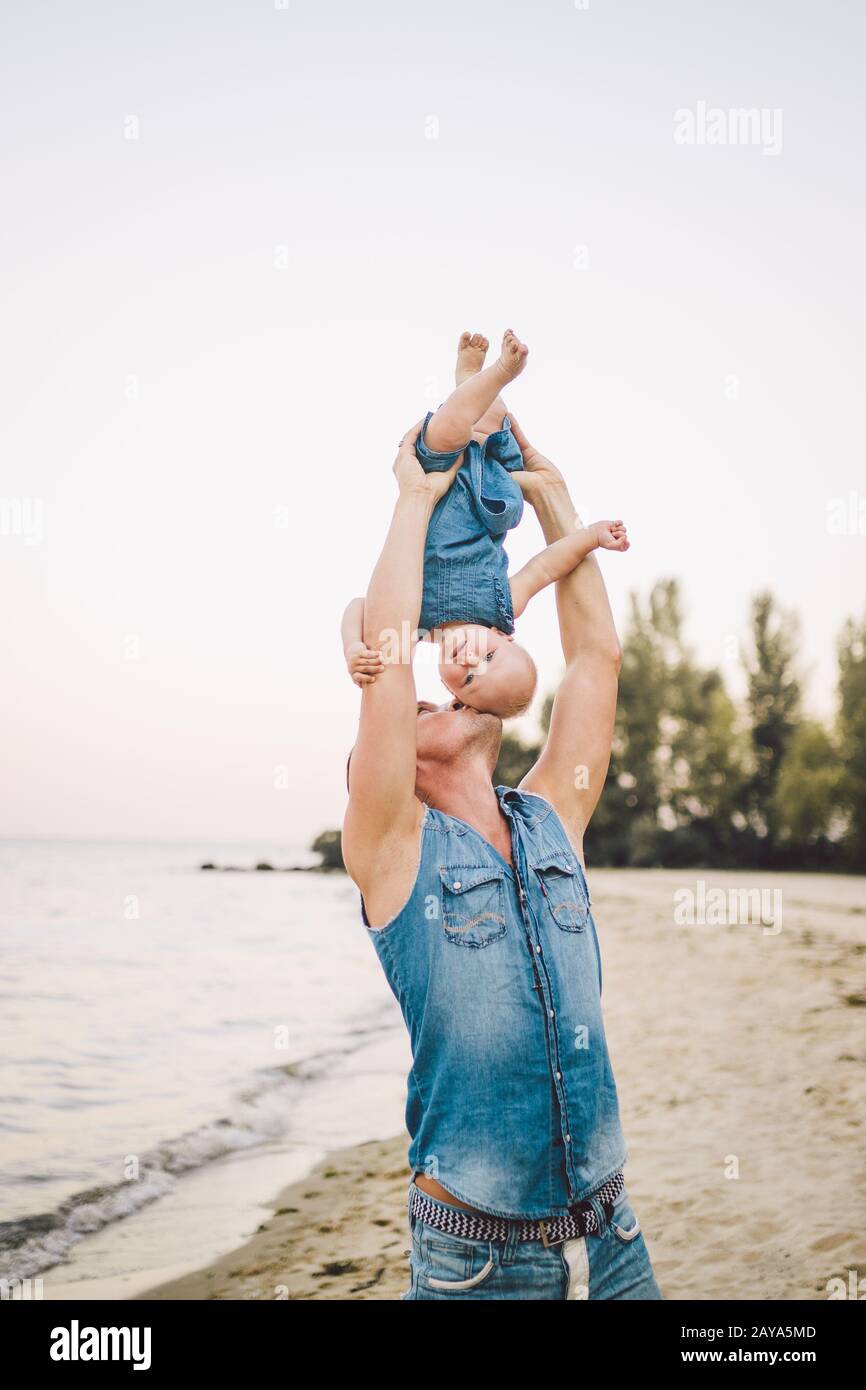Young man throwing in sea hi-res stock photography and images - Alamy