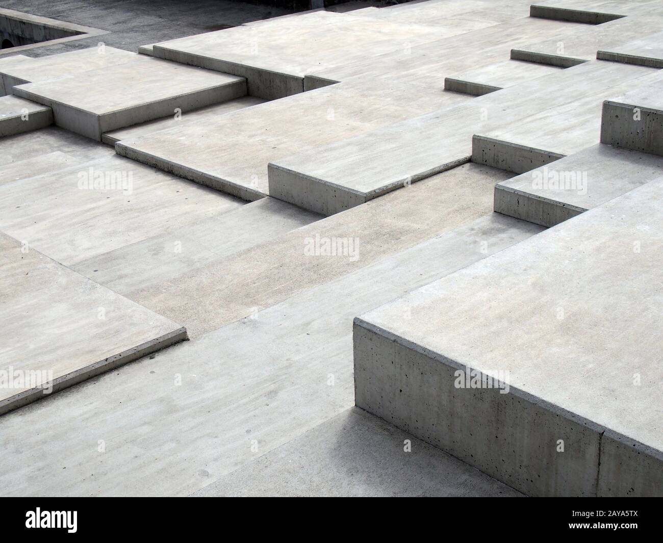 grey modern geometric cubic concrete steps forming angular patterns and ...