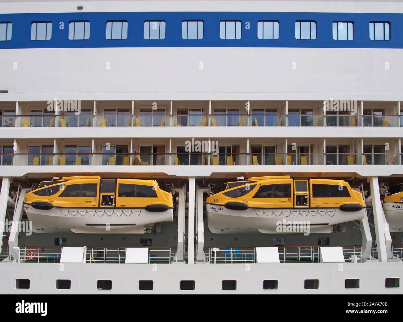 lifeboats on the aida stella cruise ship below rows of cabins with ...