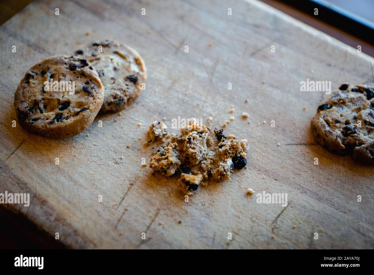 Broken chocolate chip cookies. Cookies broken in pieces with crumbs ...