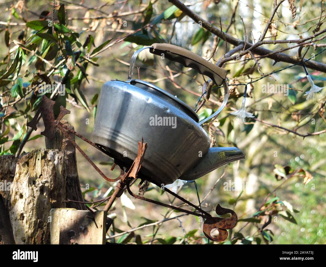 old discarded kettle on top of a gate post in a rural setting ...
