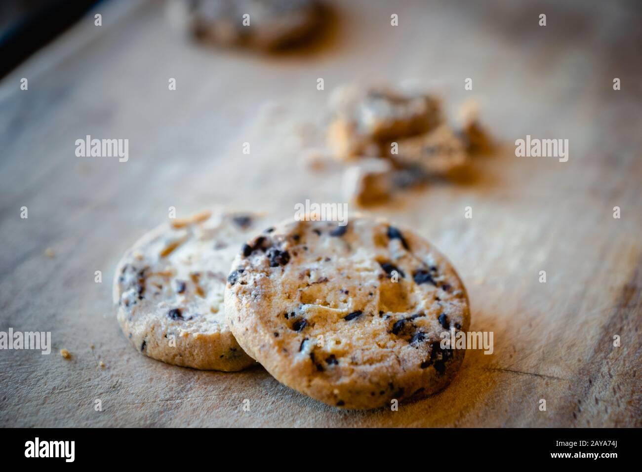Broken chocolate chip cookies. Cookies broken in pieces with crumbs ...