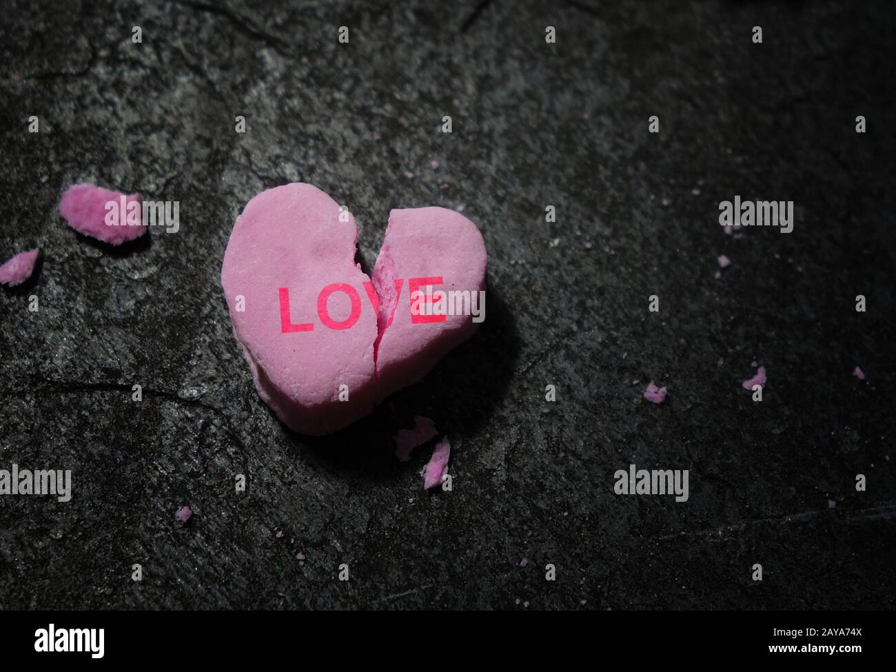 Broken pink love heart Stock Photo - Alamy