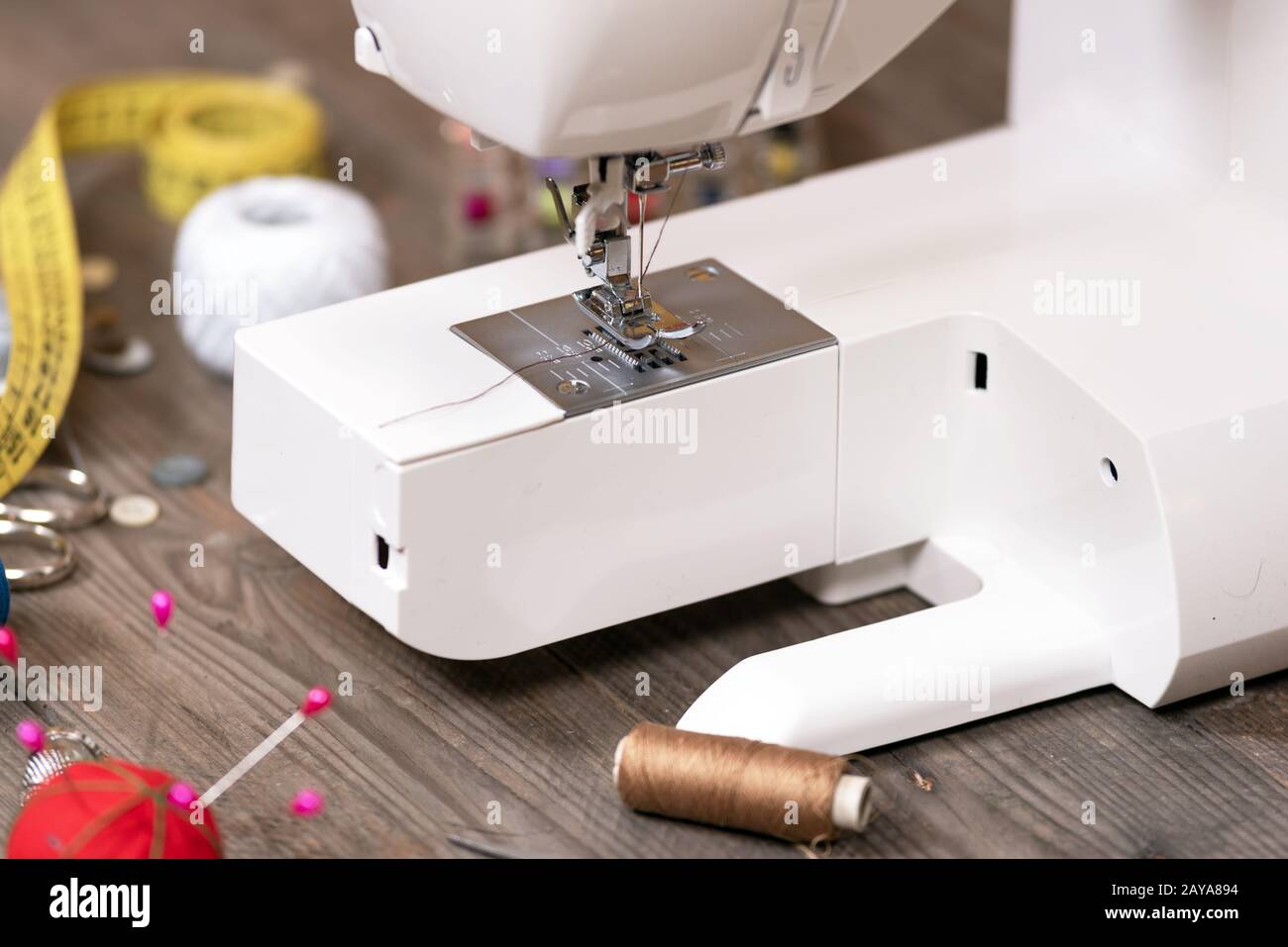 Seamstress or tailor background with sewing tools, colorful threads ...