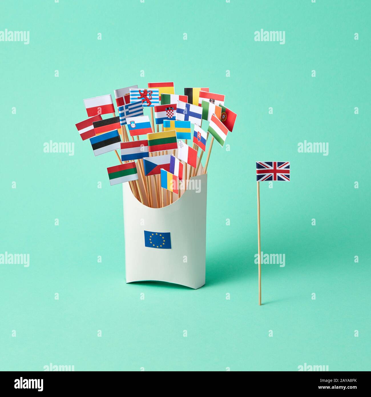 Paper Flag Of Britain And A Cardboard Box With A Sign Of The EU And paper-flag-of-britain-and-a-cardboard-box-with-a-sign-of-the-eu-and