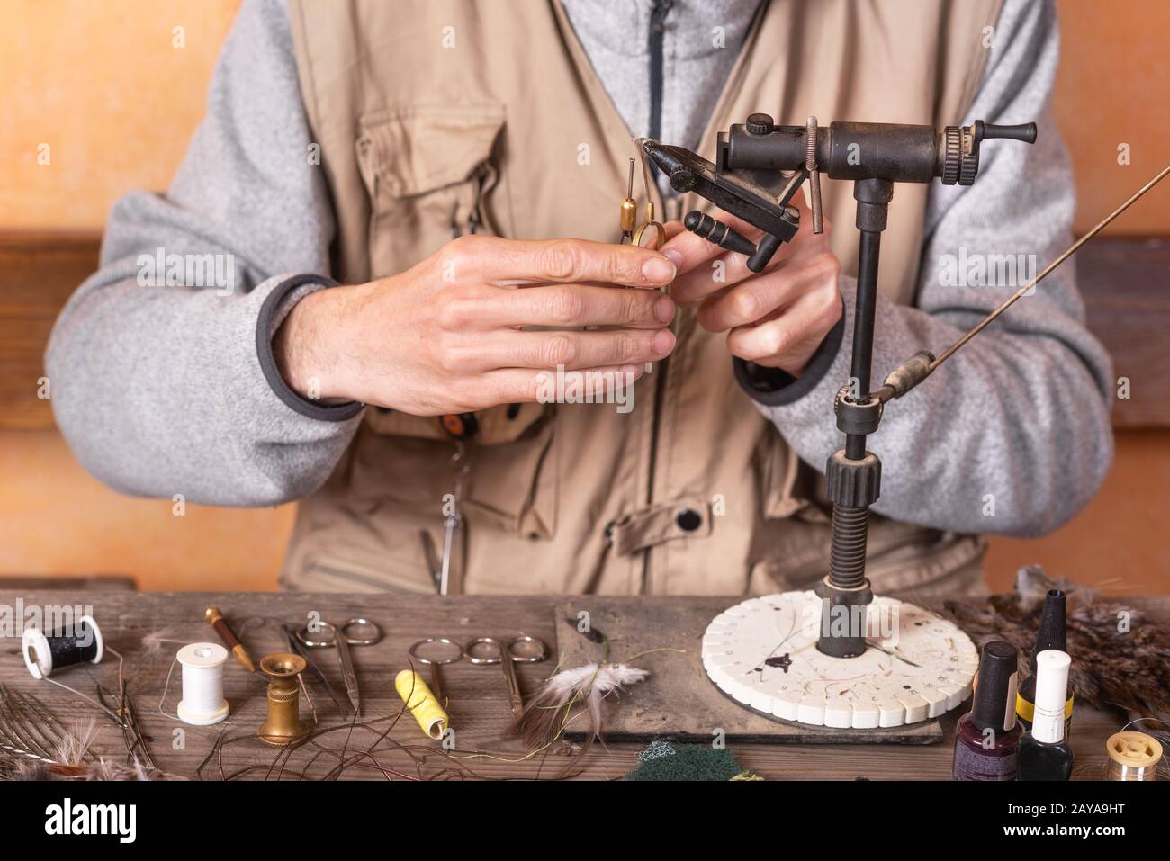 Hands tying hook hi-res stock photography and images - Alamy