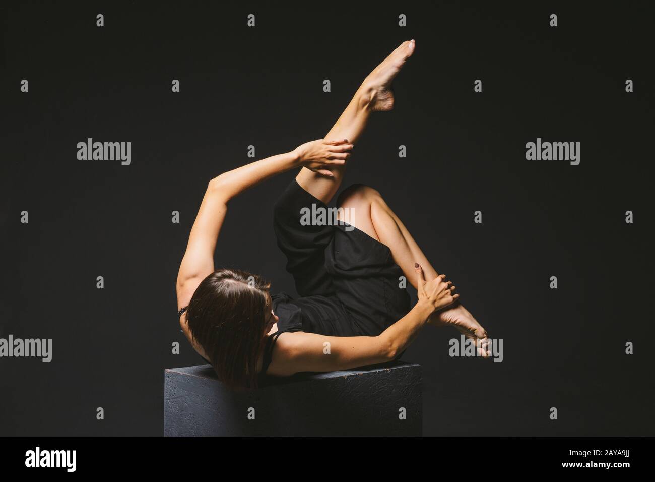 Social theme. young Caucasian woman in strange pose in dress posing on ...