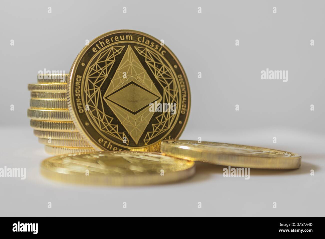 Golden Etherium coin close up on white background Stock Photo - Alamy