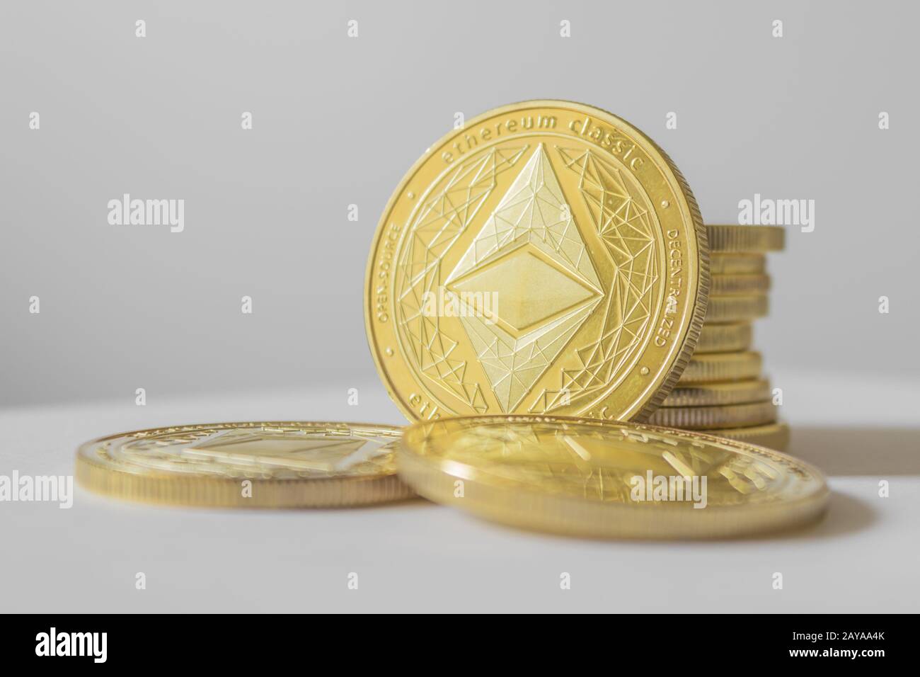 Golden Etherium coin close up on white background Stock Photo - Alamy