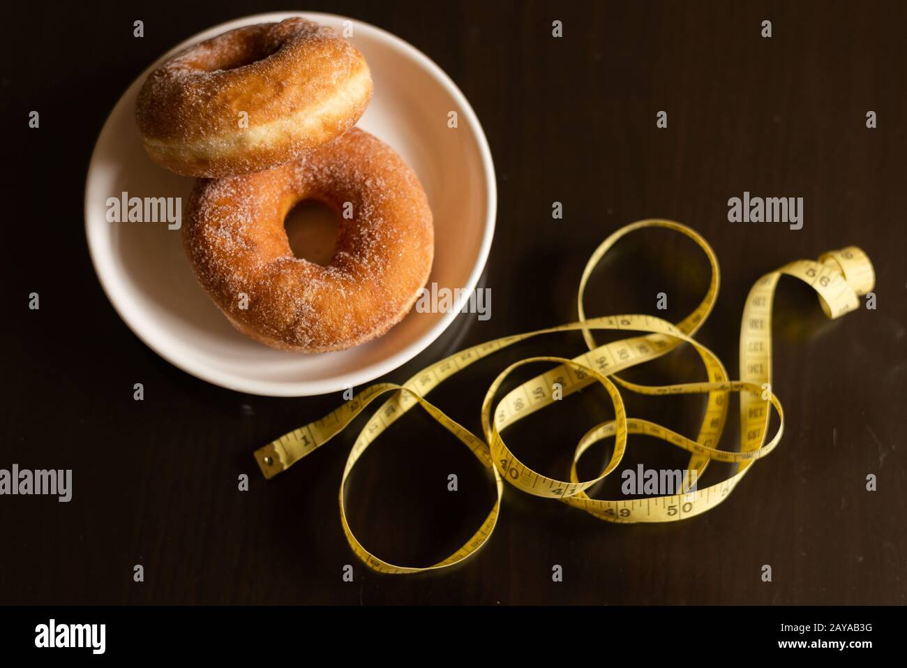 donuts with tailor measuring tape Stock Photo - Alamy