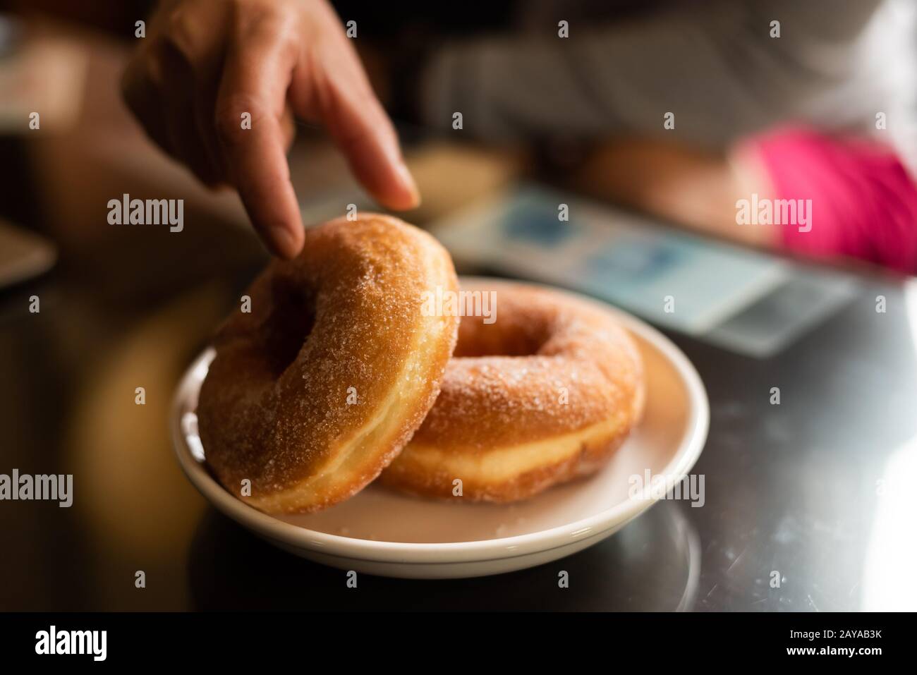 take a donut Stock Photo - Alamy
