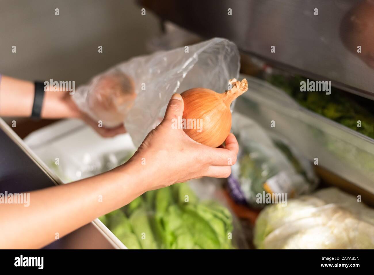 take vegetables from refrigerator Stock Photo - Alamy