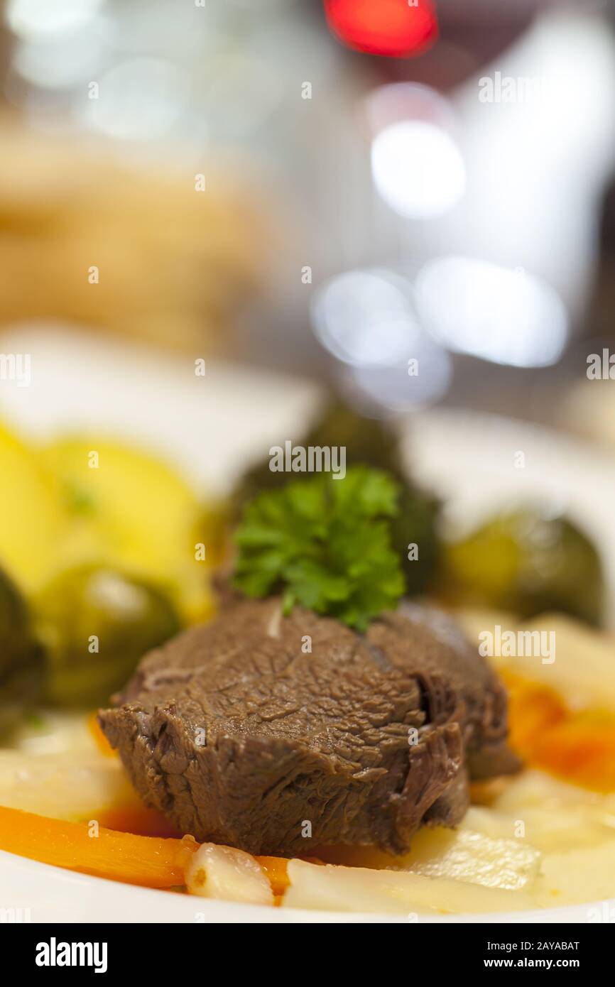 Boiled beef on a plate with vegetables Stock Photo - Alamy