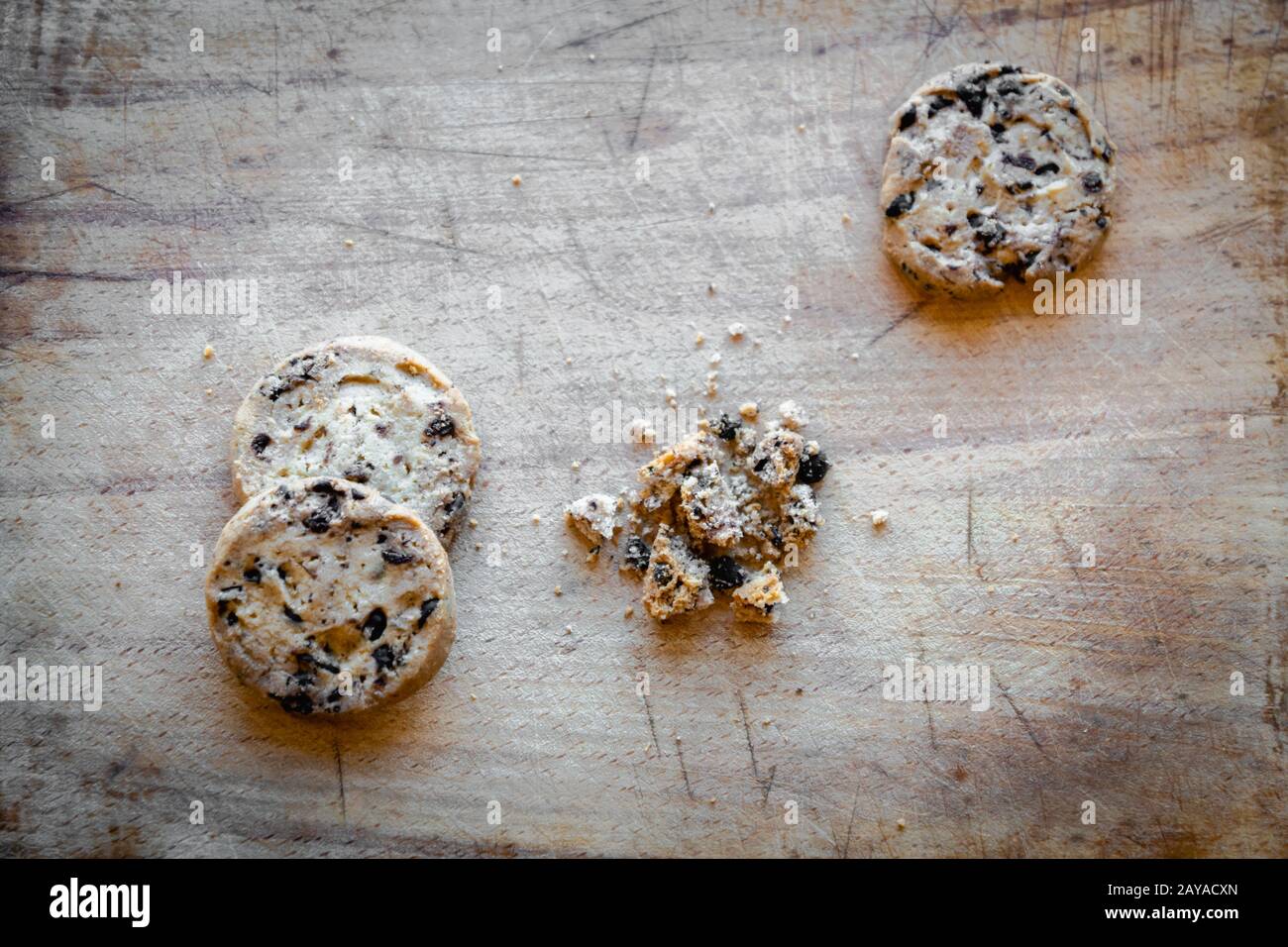 Broken chocolate chip cookies. Cookies broken in pieces with crumbs ...