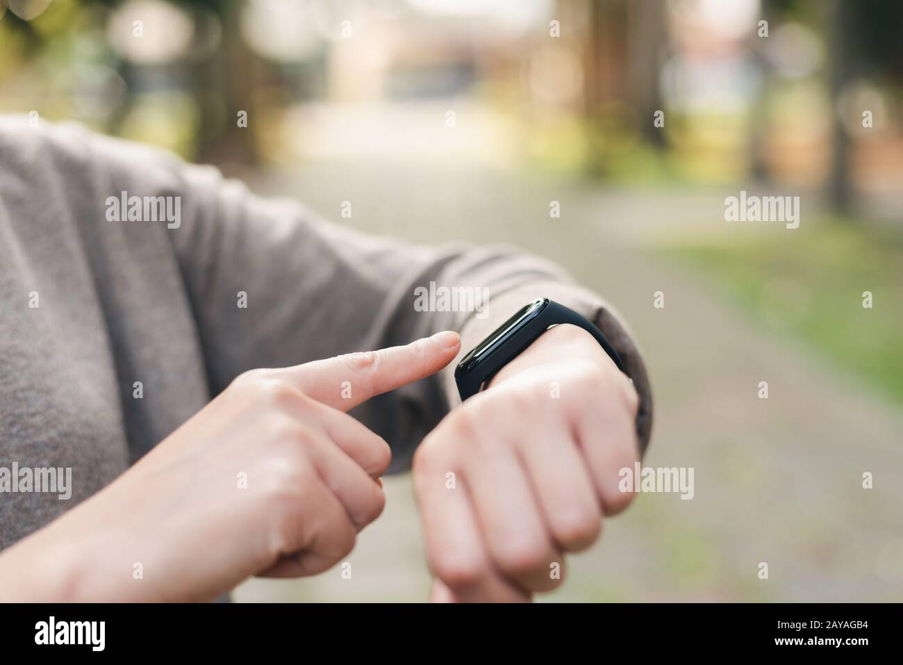 Woman using smartwatch touchscreen technology hi-res stock photography ...
