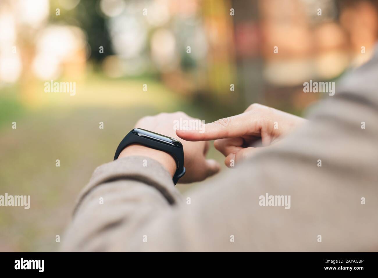 Woman using smartwatch touchscreen technology hi-res stock photography ...