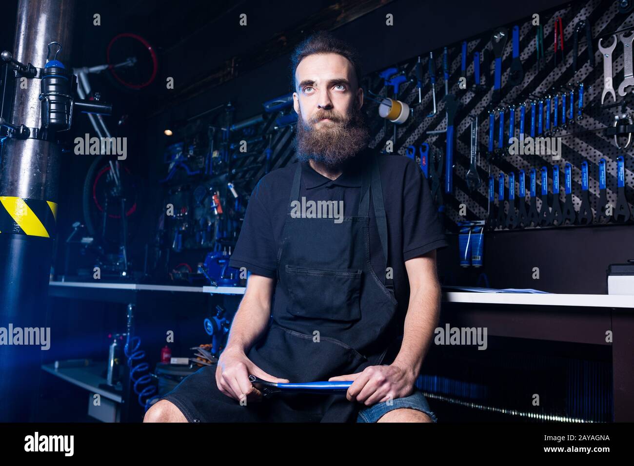 Portrait of small business owner of young man with beard. Guy bicycle ...