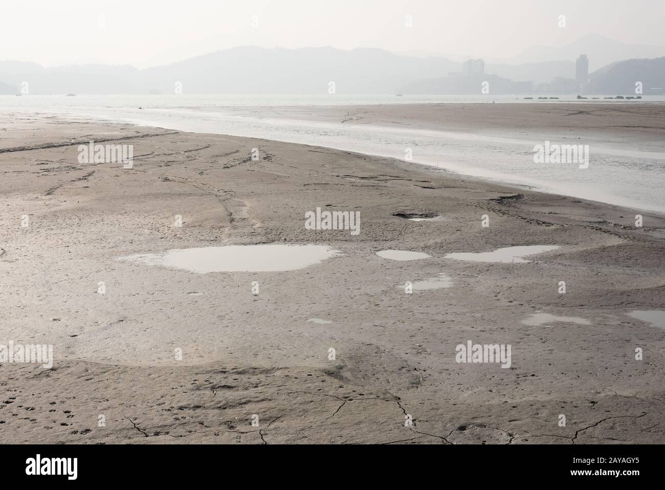 dry mud landscape with water Stock Photo - Alamy