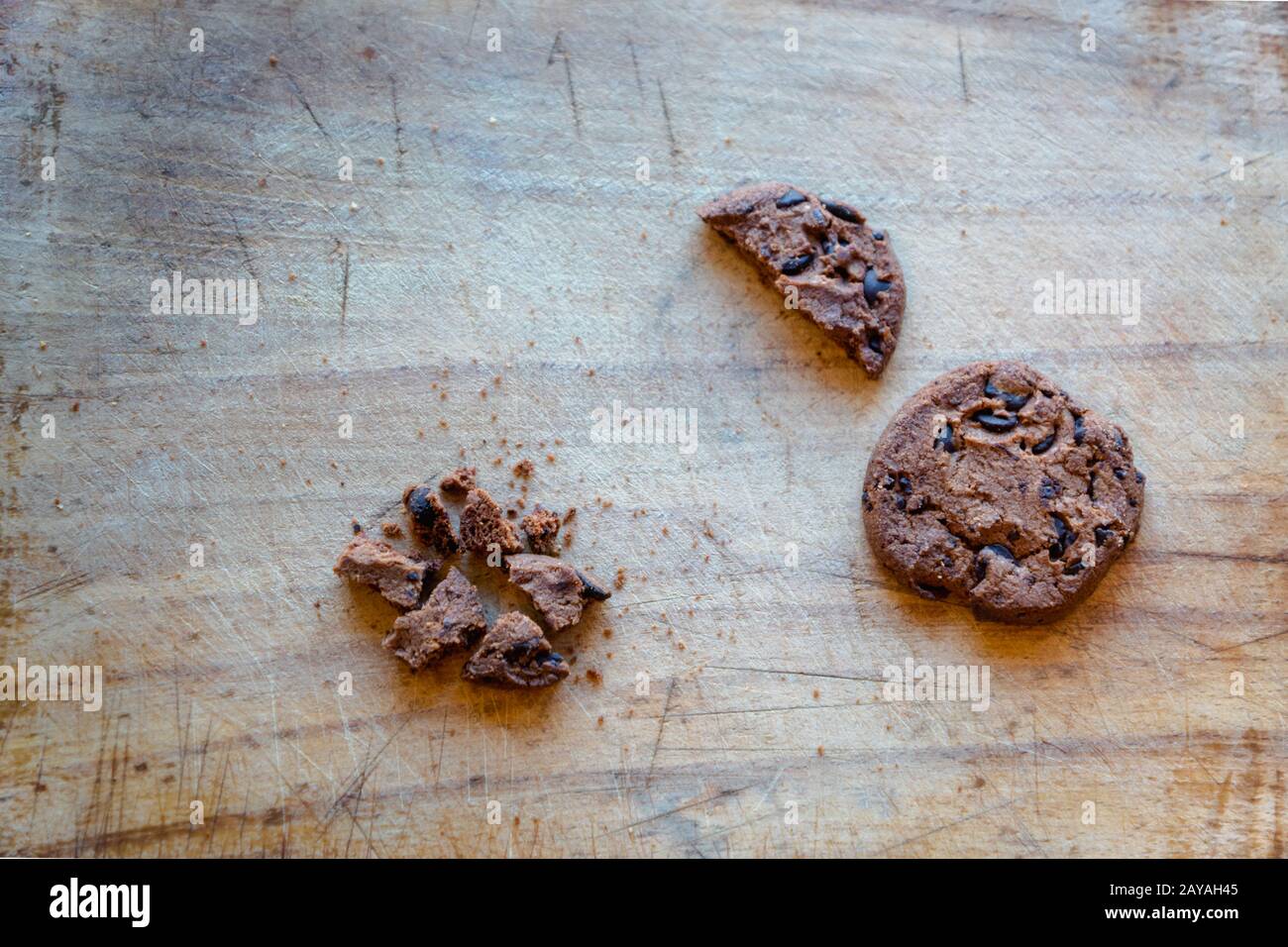 Broken chocolate chip cookies. Cookies broken in pieces with crumbs ...