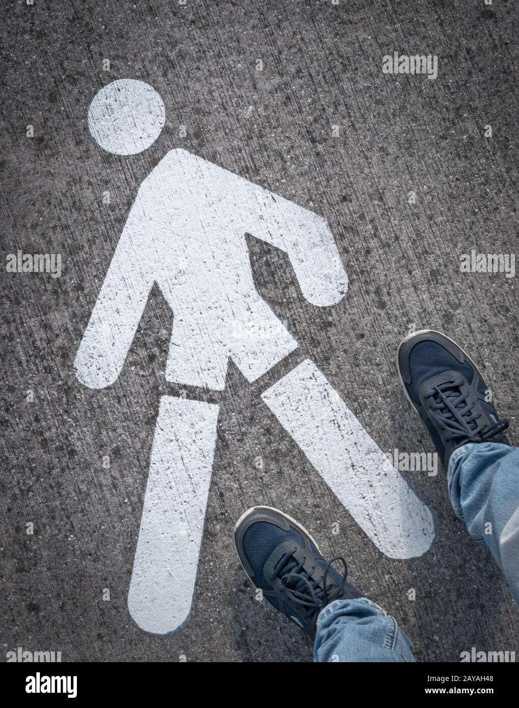 Man near at the pedestrian road sign Stock Photo - Alamy