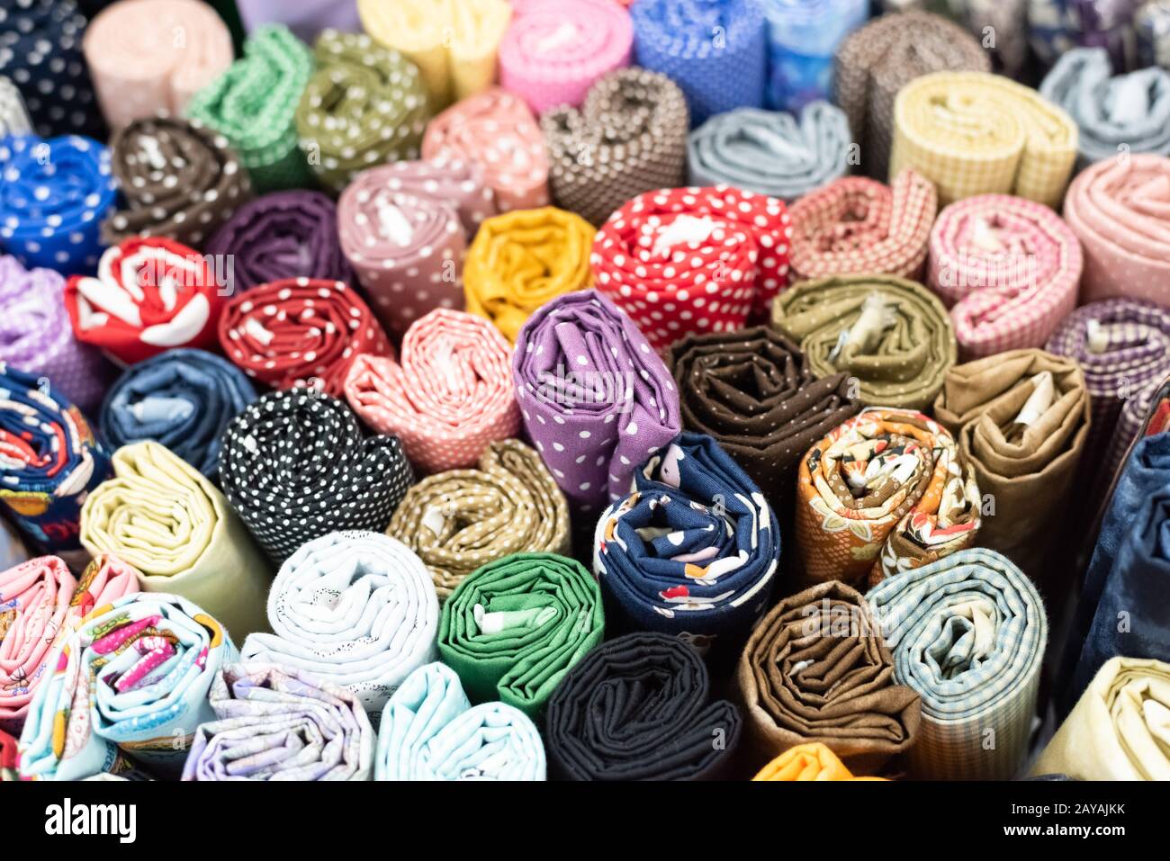 background of colorful fabric stacks Stock Photo - Alamy
