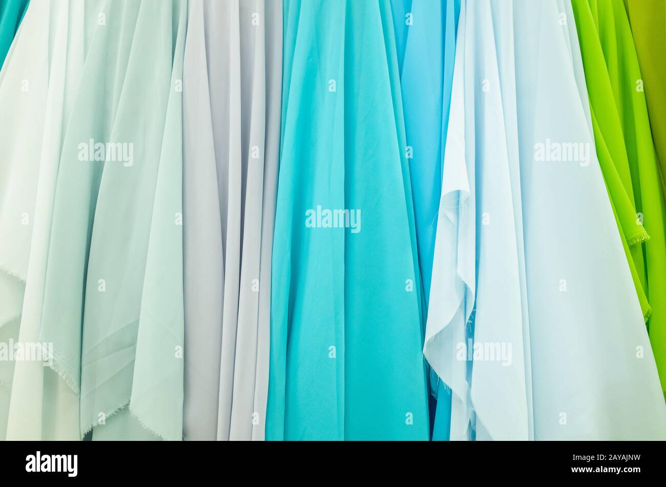 background of colorful fabric stacks Stock Photo - Alamy