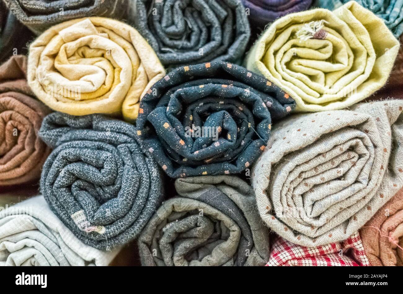 background of colorful fabric stacks Stock Photo - Alamy