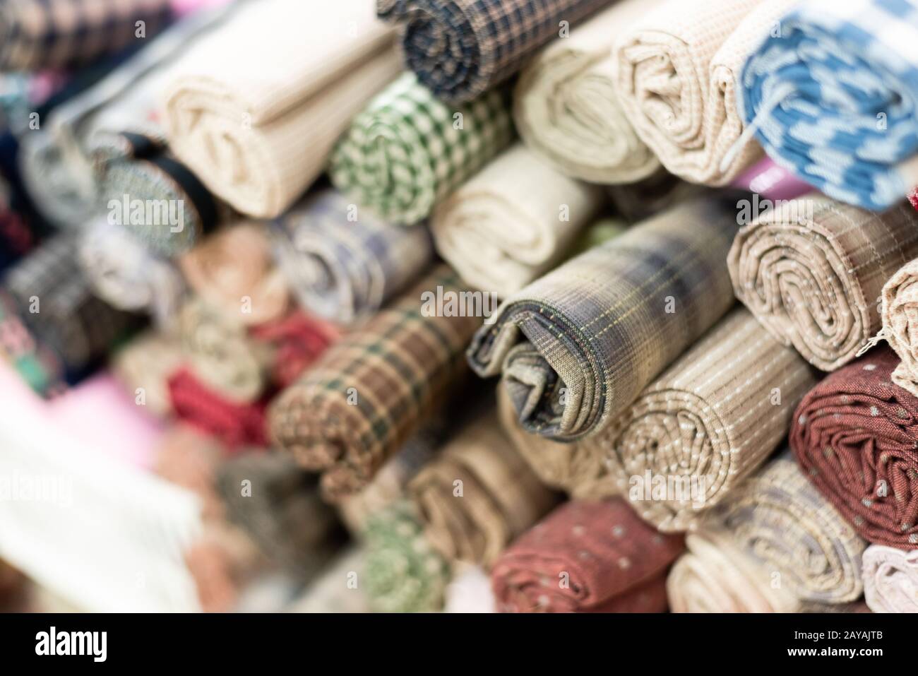 background of colorful fabric stacks Stock Photo - Alamy