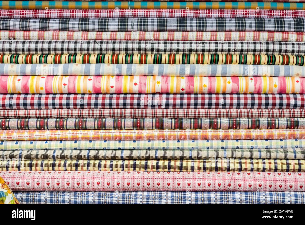 background of colorful fabric stacks Stock Photo - Alamy