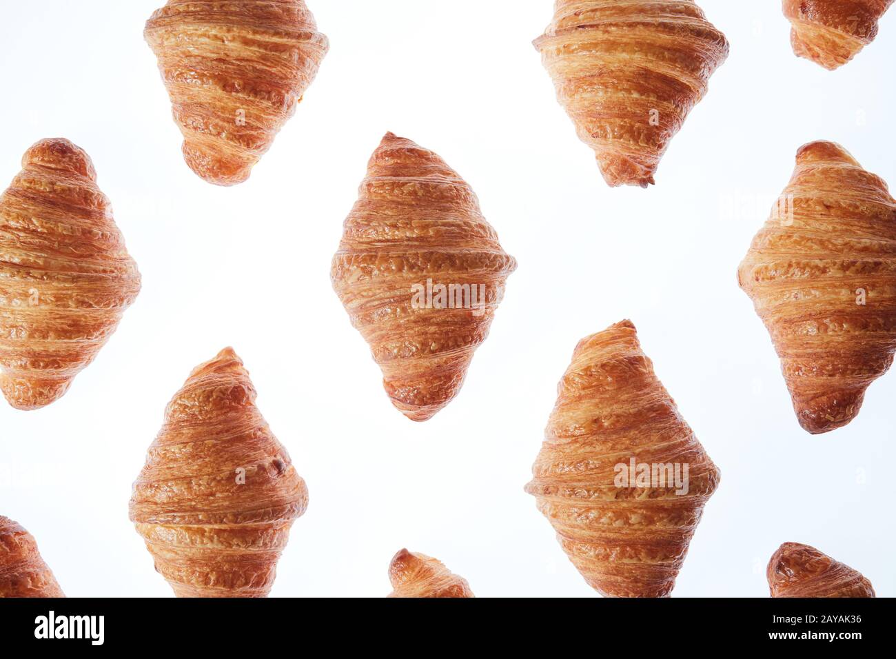 Homemade french croissants pattern on a white background Stock Photo ...