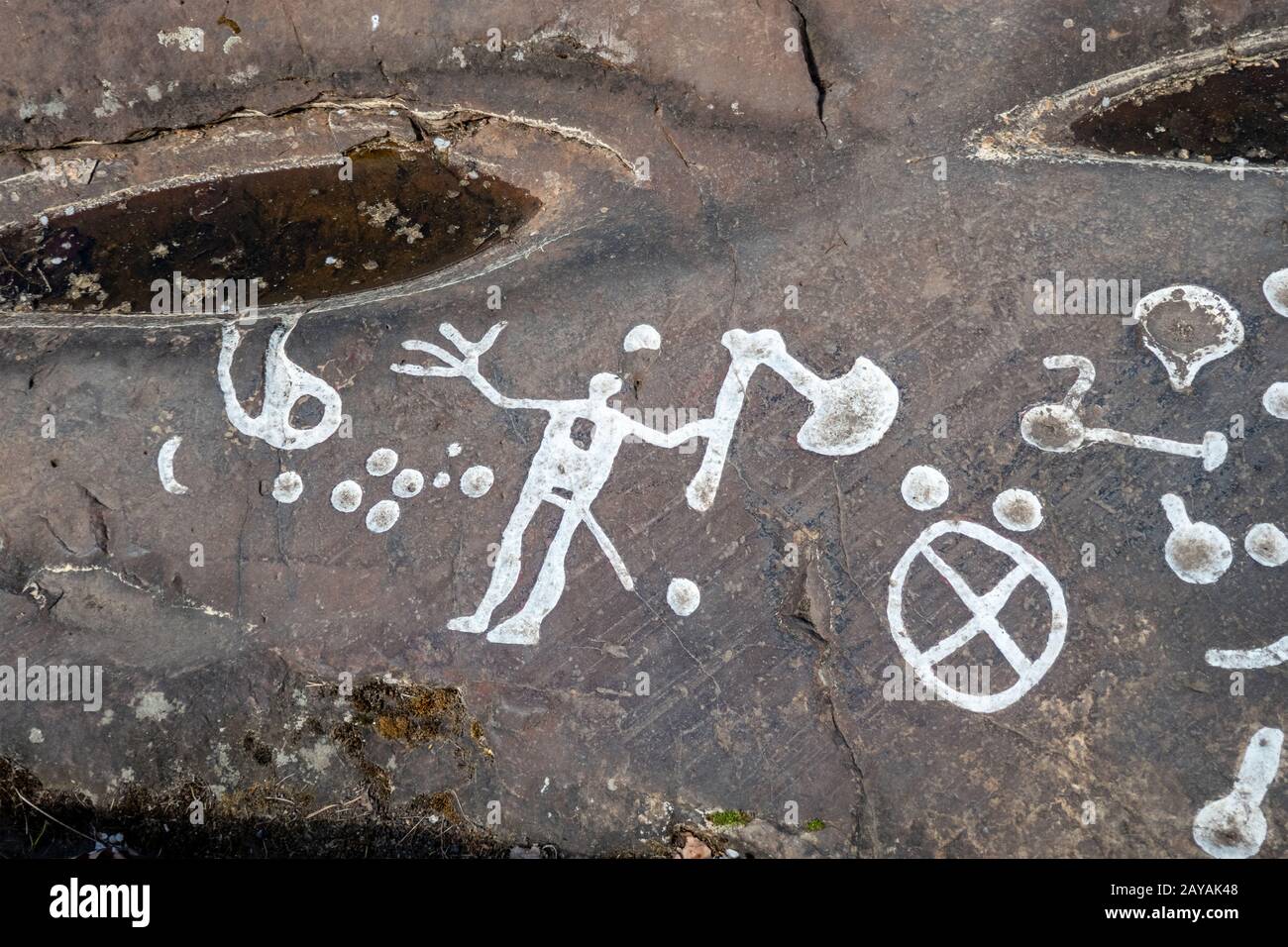 Rock carvings of the Axe god Stock Photo - Alamy