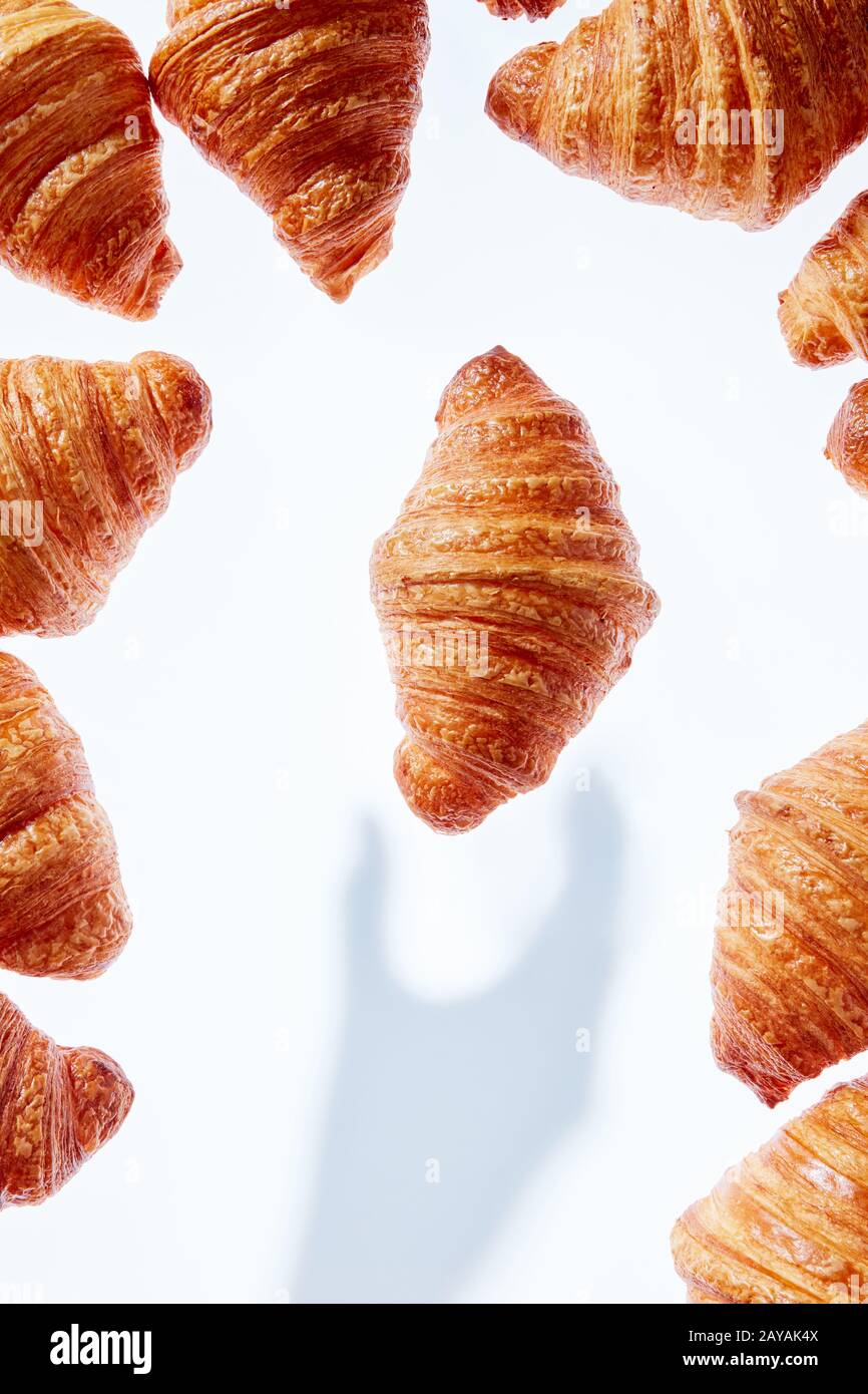 Pastry frame with shadow from hand on a light background Stock Photo ...