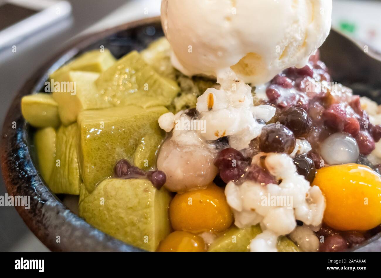 eating shaved ice with colorful dessert Stock Photo - Alamy